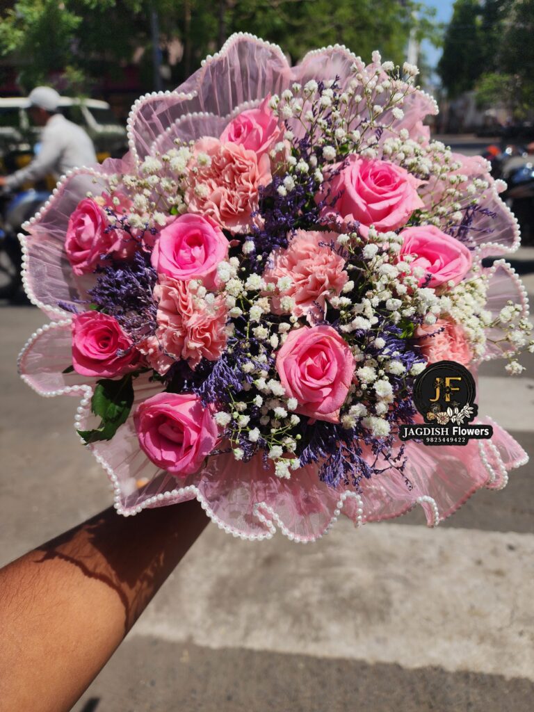 ELEGANT AND LOVELY BOUQUET OF PINK ROSES AND CARNATIONS WRAPPED IN PINK PEARL NET – Jagdish ...